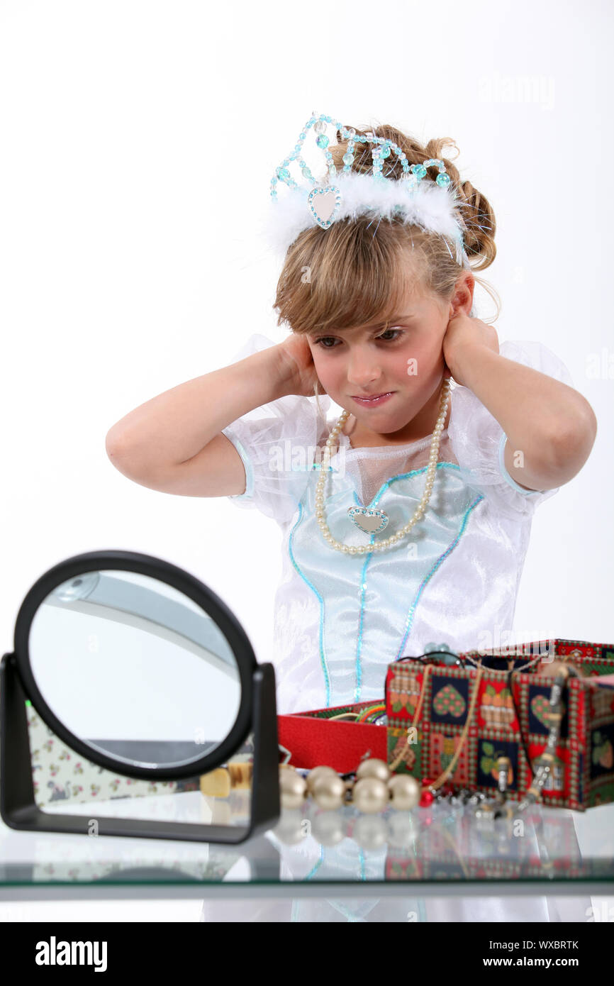 Young girl playing dress-up Stock Photo - Alamy