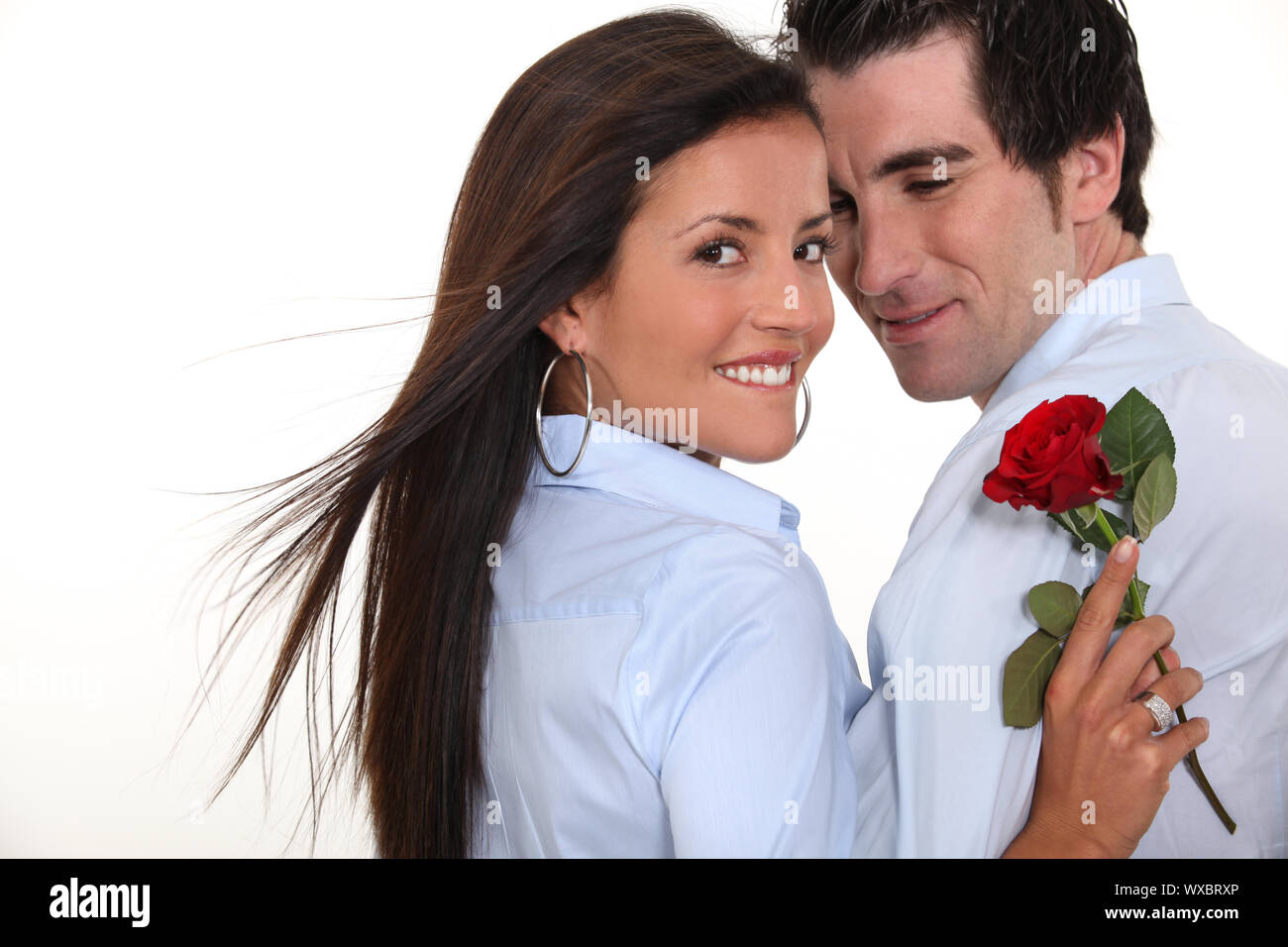 Man offering rose to woman Stock Photo - Alamy
