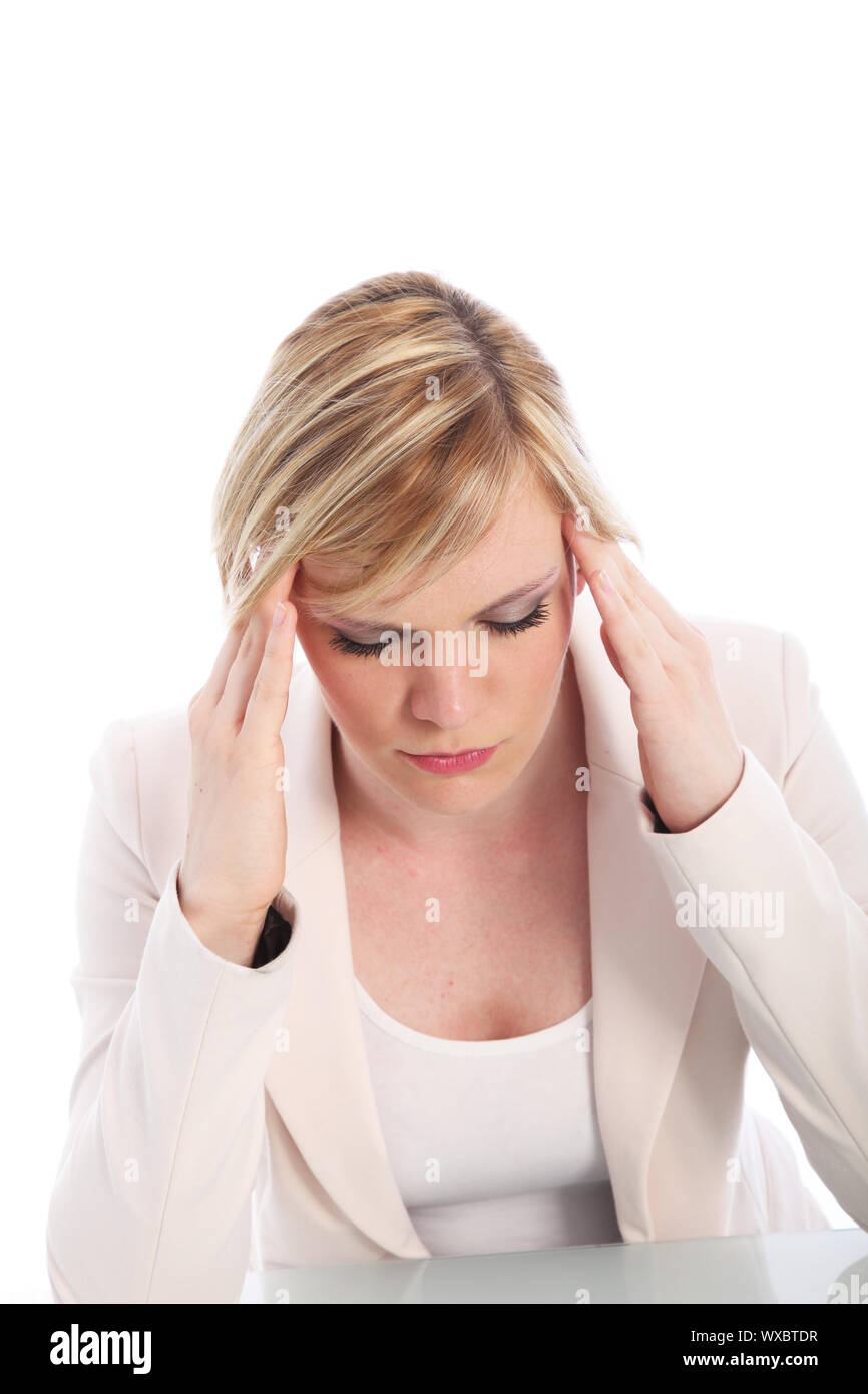 Woman suffering from a migraine or headache massaging her throbbing ...