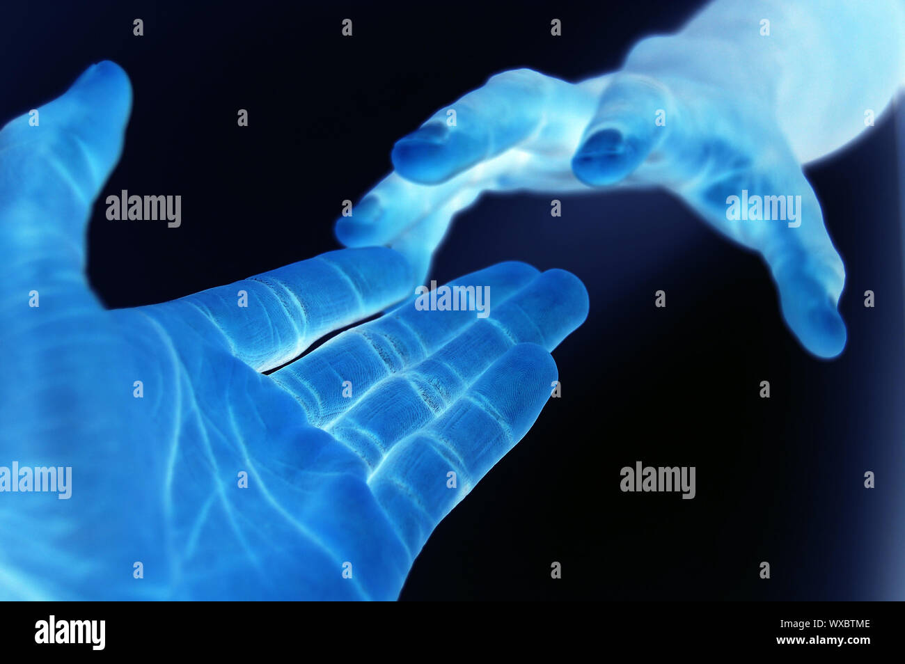 This is an image of a pair of hands reaching out to each other. This ...