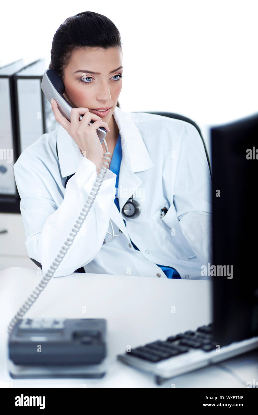 Attractive female doctor making phone call with the patient, white ...