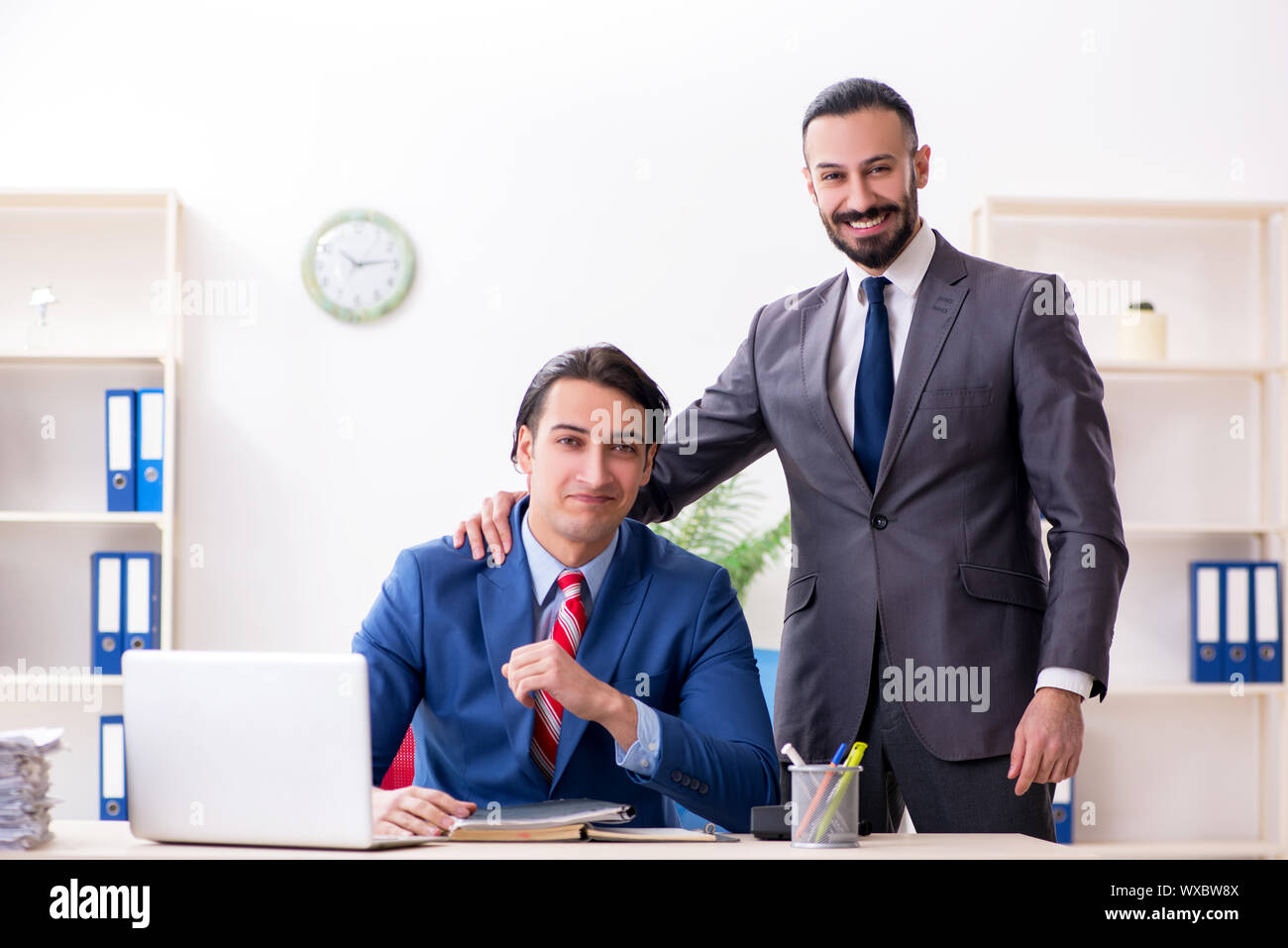 Two male colleagues in the office Stock Photo - Alamy