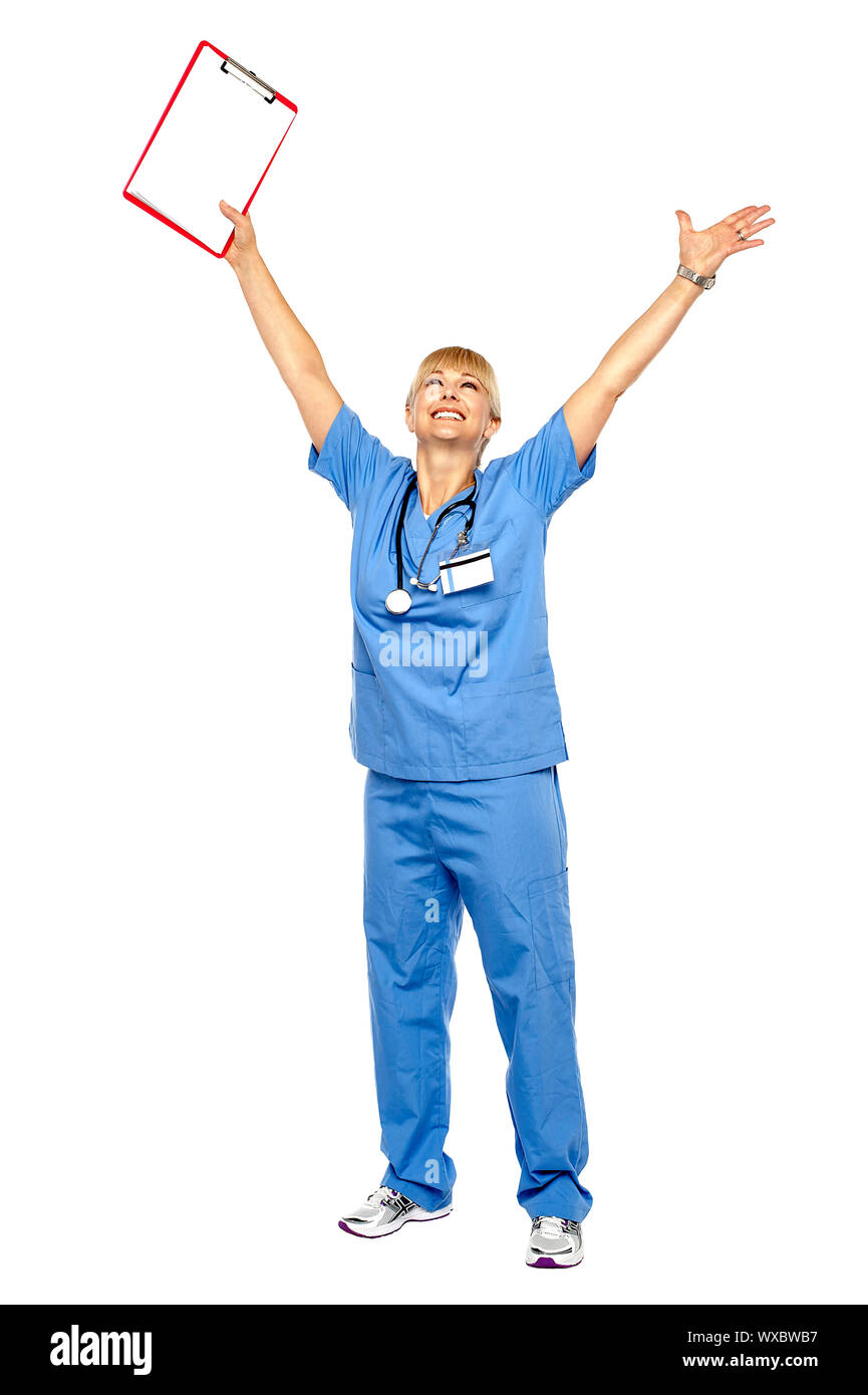 Long shot of a jubilant doctor celebrating her success by throwing ...