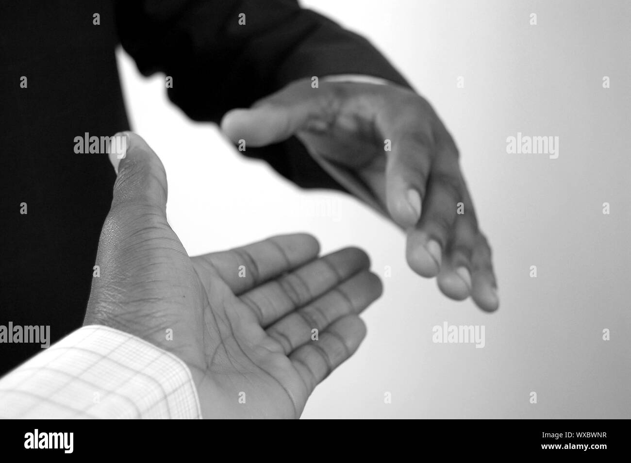 This is an image of a two hands about to perform a handshake Stock ...