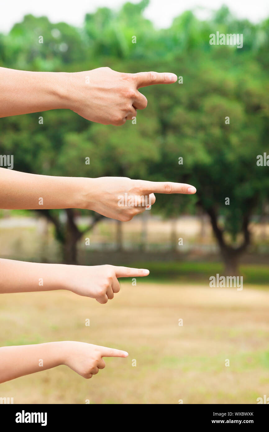 hands of family pointing to same direction Stock Photo - Alamy