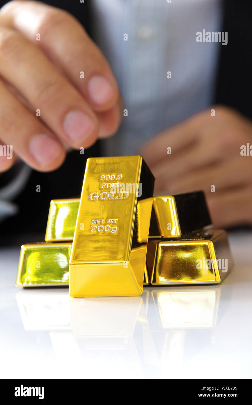 hand holding gold bars Stock Photo - Alamy