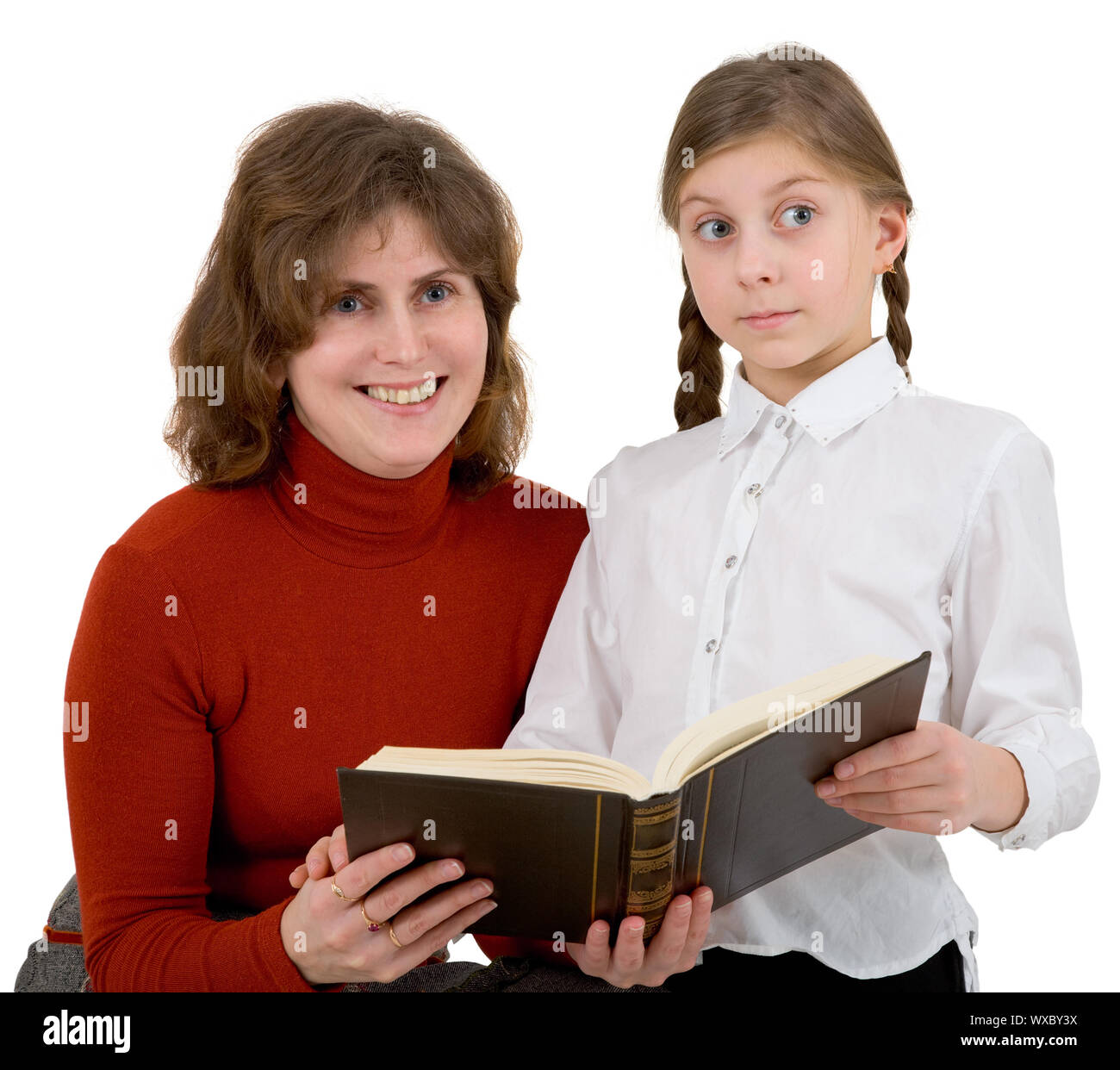 Woman with girl reading book on white Stock Photo - Alamy