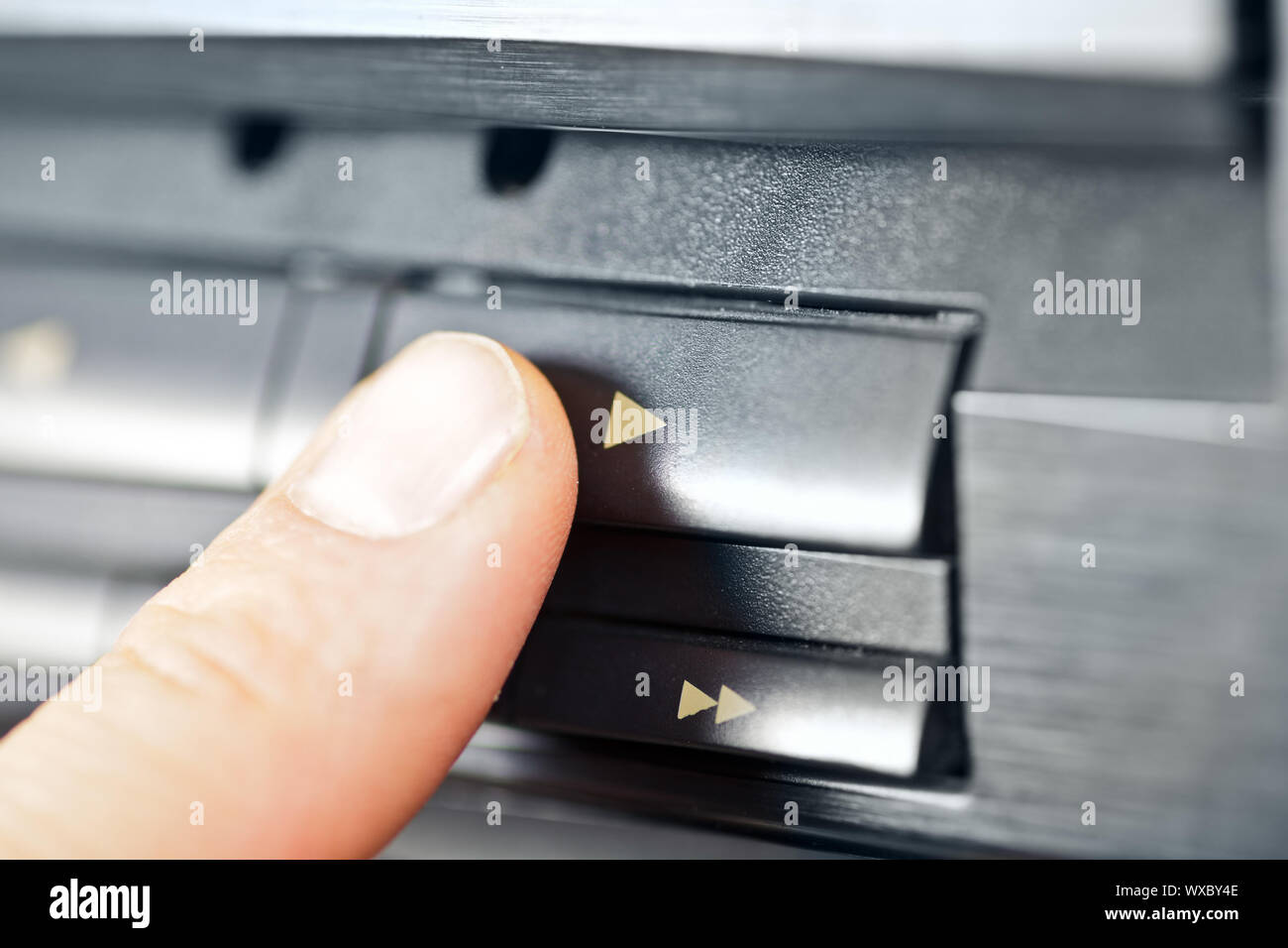 Finger pushing play button on a vintage audio cassette deck Stock Photo ...