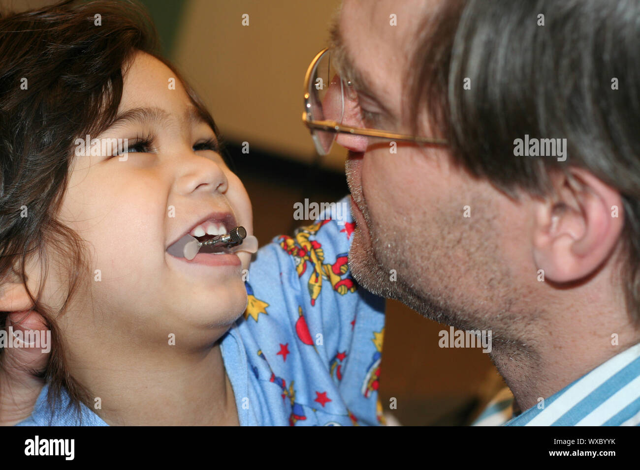 Sick child playing with father in hospital Stock Photo - Alamy