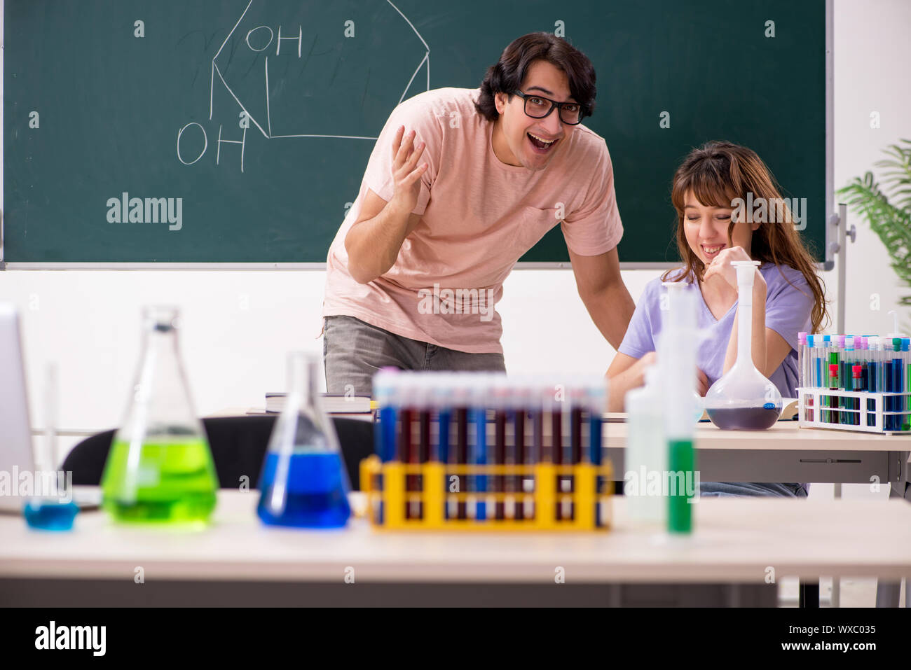 Two chemists students in classroom Stock Photo - Alamy