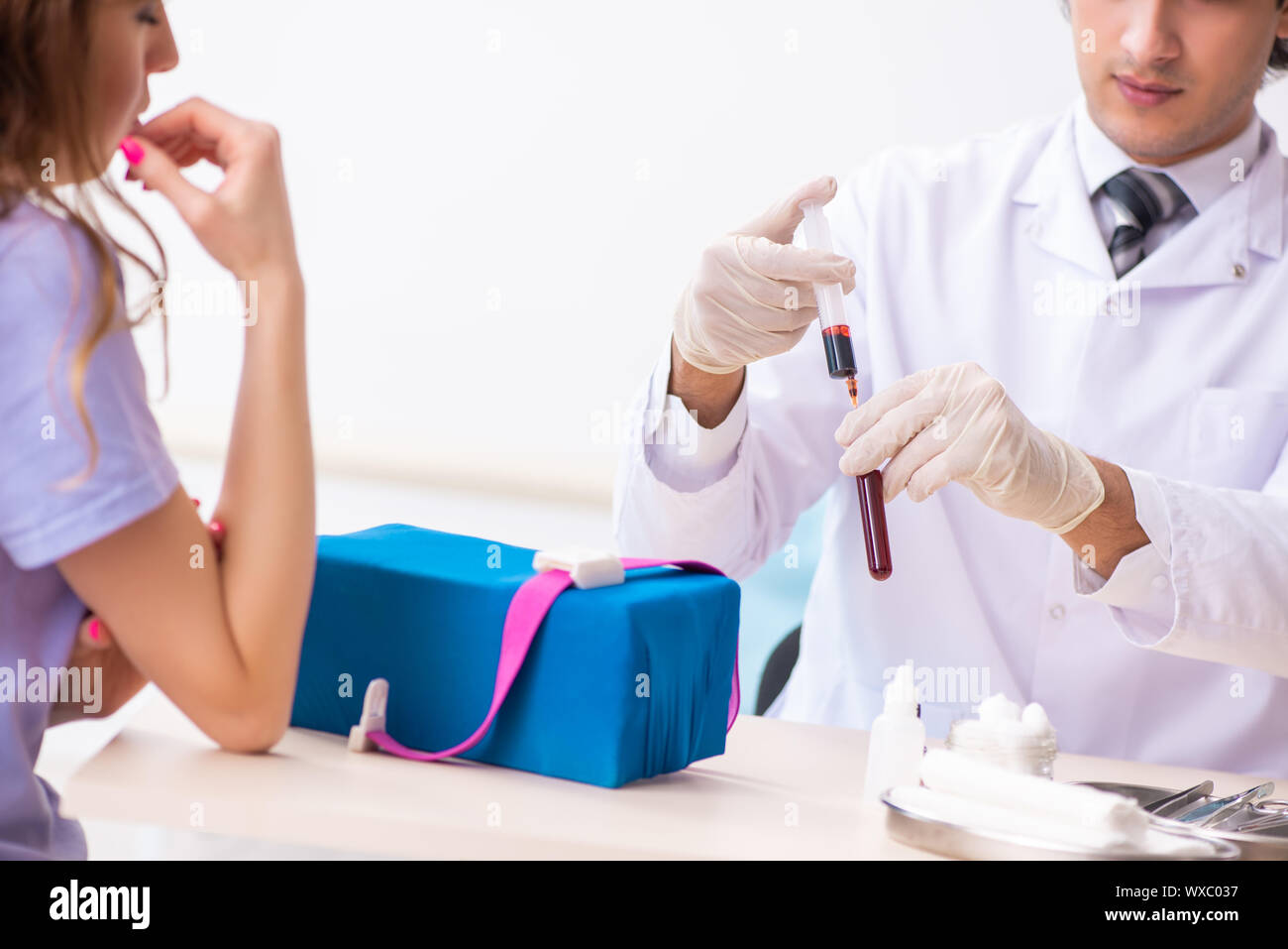 Female patient during blood test sampling procedure Stock Photo - Alamy