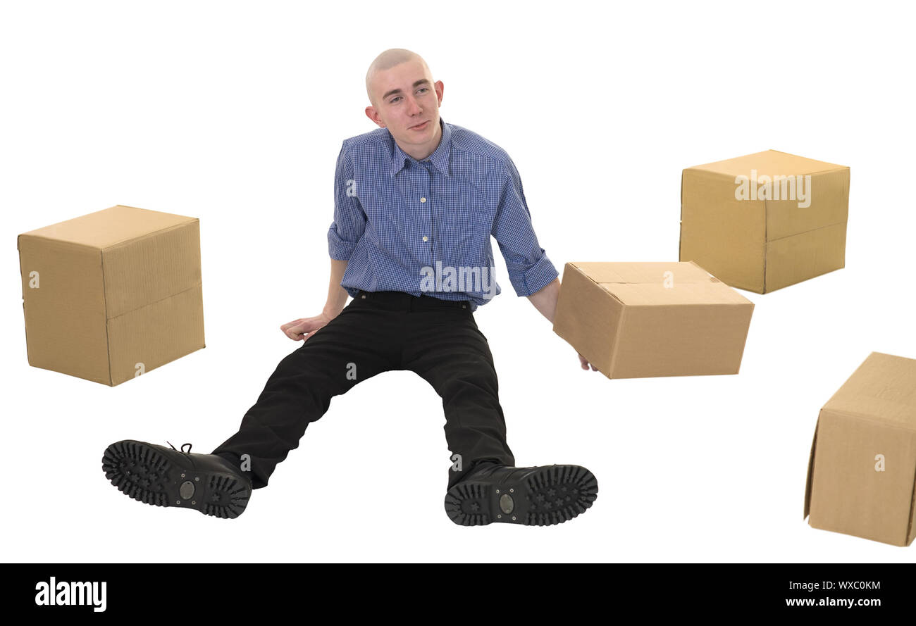 Man but around scattered boxes on white Stock Photo - Alamy