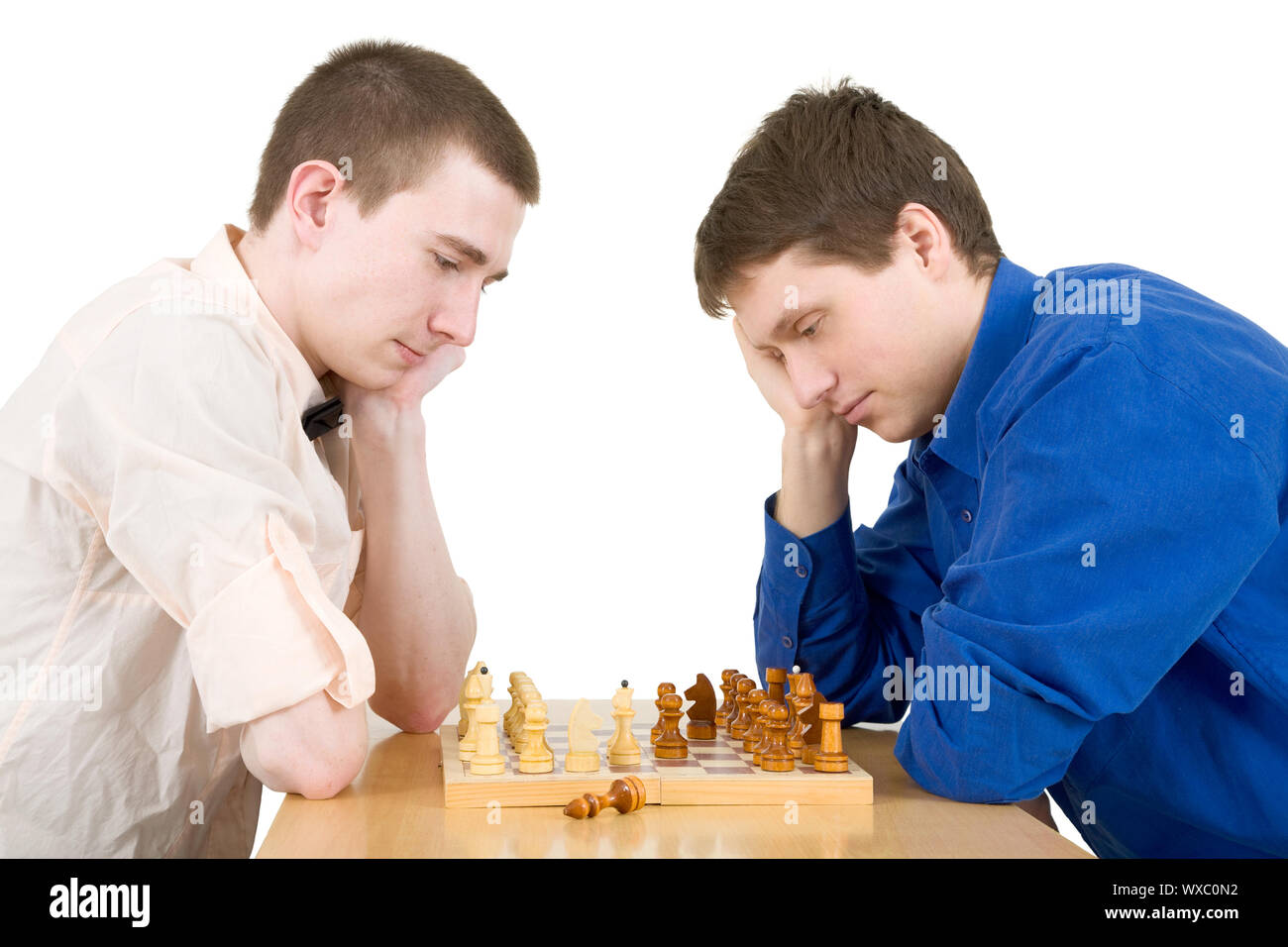 Men play chess on a white background Stock Photo - Alamy