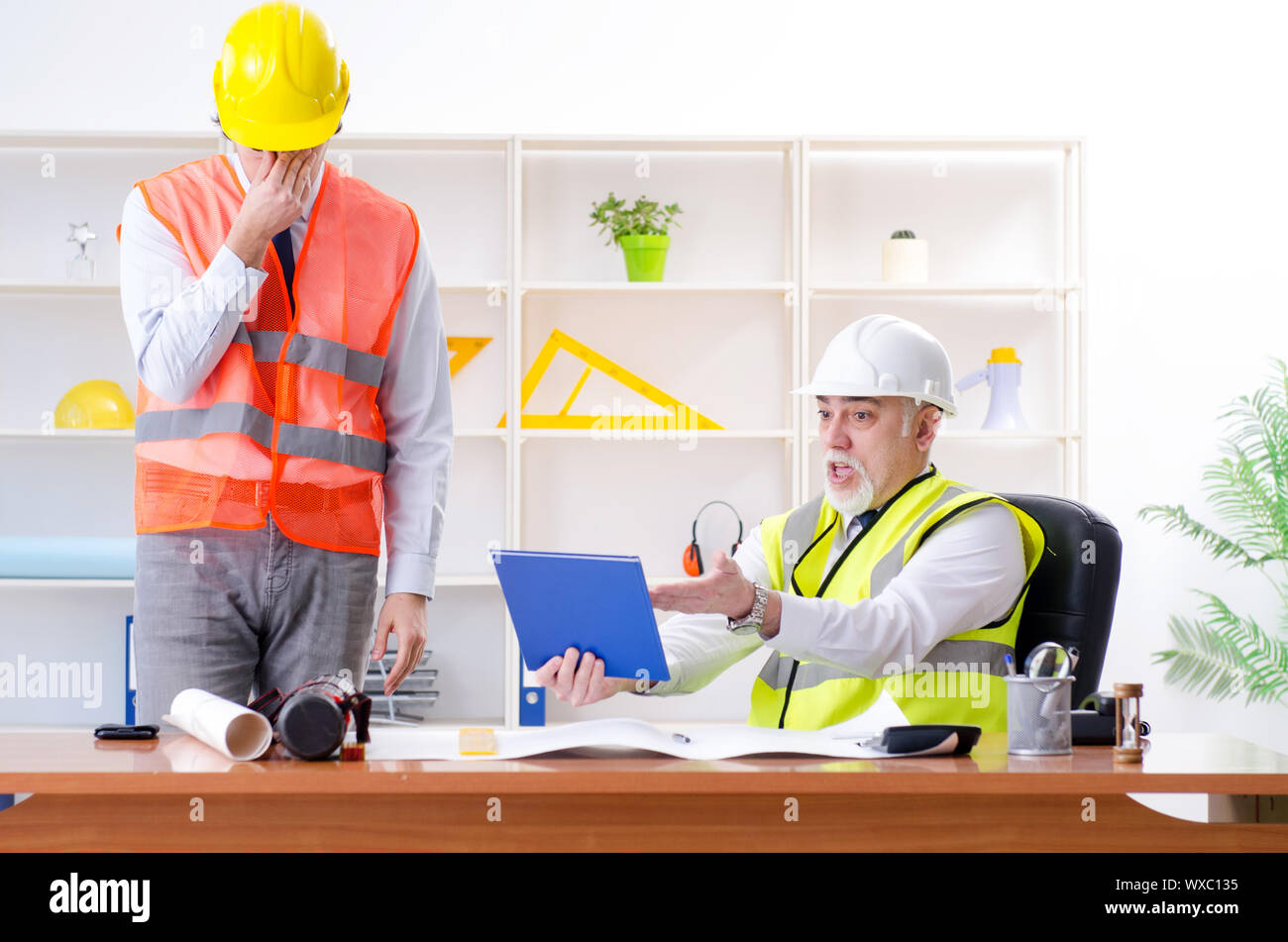 Two engineers colleagues working under project Stock Photo - Alamy