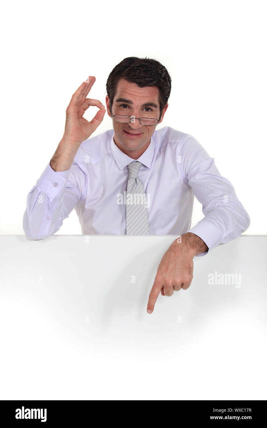 Businessman giving his sign of approval Stock Photo - Alamy