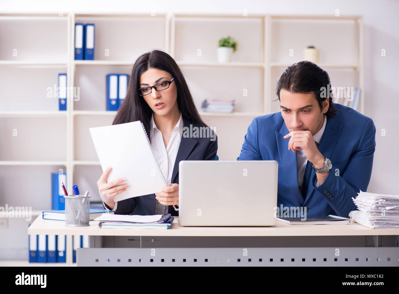 Two concentrated employees working hi-res stock photography and images ...