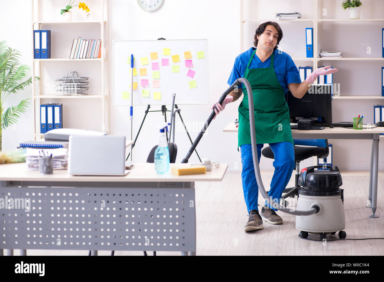 Office vacuuming hi-res stock photography and images - Alamy