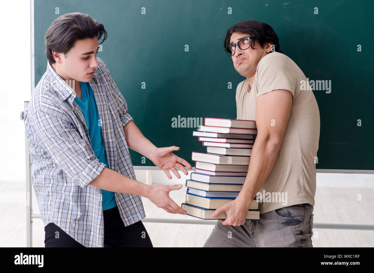 Two male students in the classroom Stock Photo - Alamy
