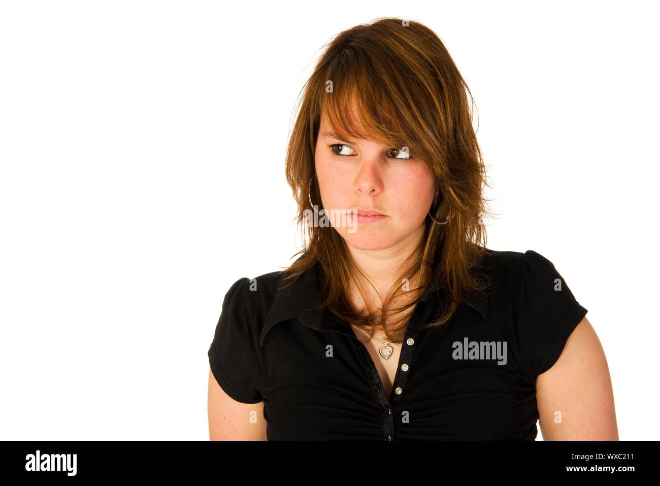 Very angry looking girl in portrait on white background Stock Photo - Alamy