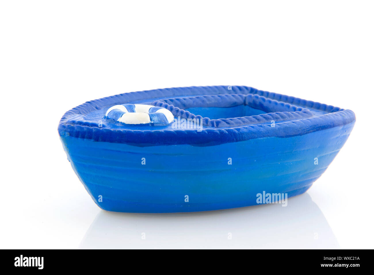 Blue boat with life buoy isolated over white Stock Photo - Alamy