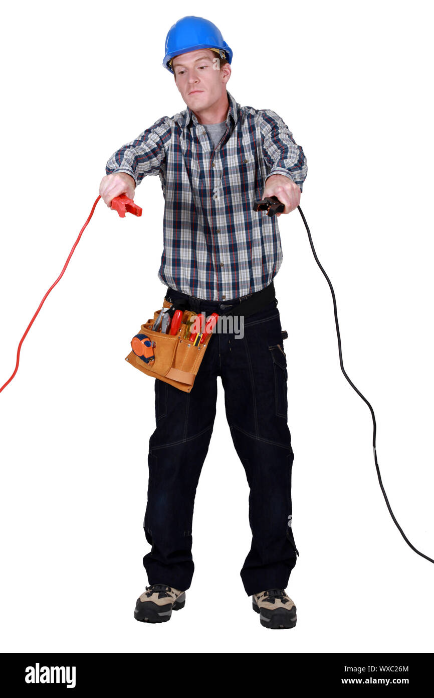 Man holding jumper cables hi-res stock photography and images - Alamy