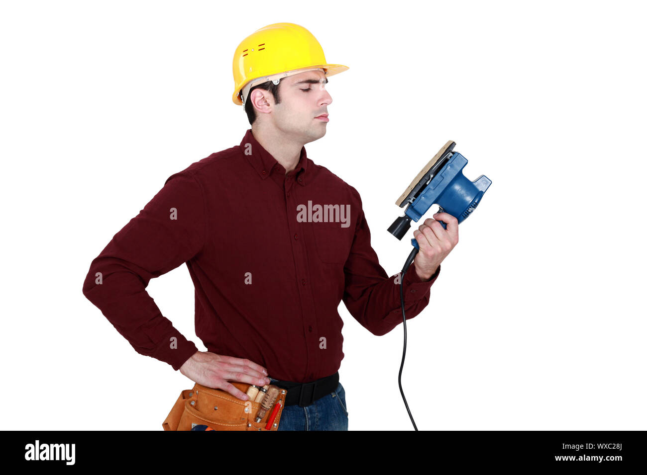 Man holding electric sander Stock Photo - Alamy