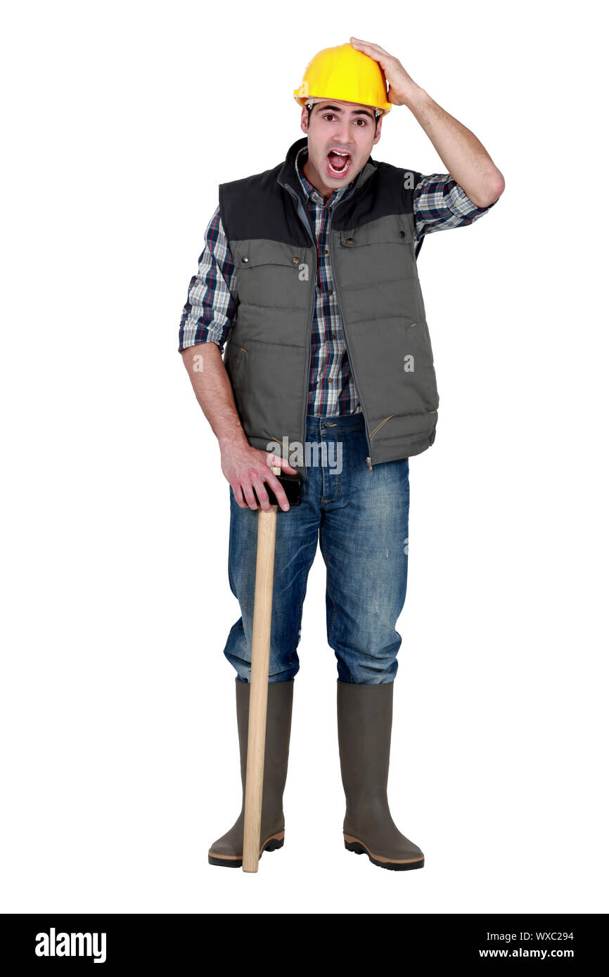 A horrified tradesman Stock Photo - Alamy