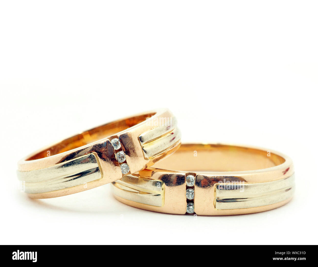 Gold wedding rings isolated on white background Stock Photo - Alamy