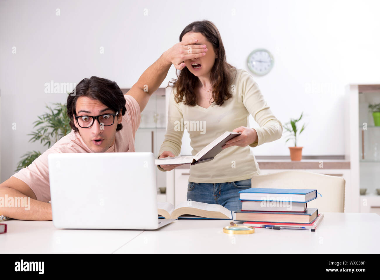 Students preparing for exam together at home Stock Photo - Alamy
