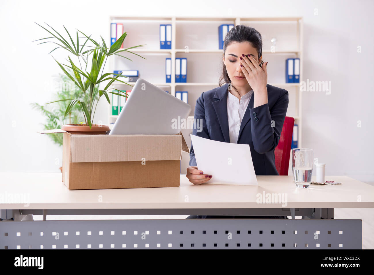 Young female employee being fired from her work Stock Photo - Alamy