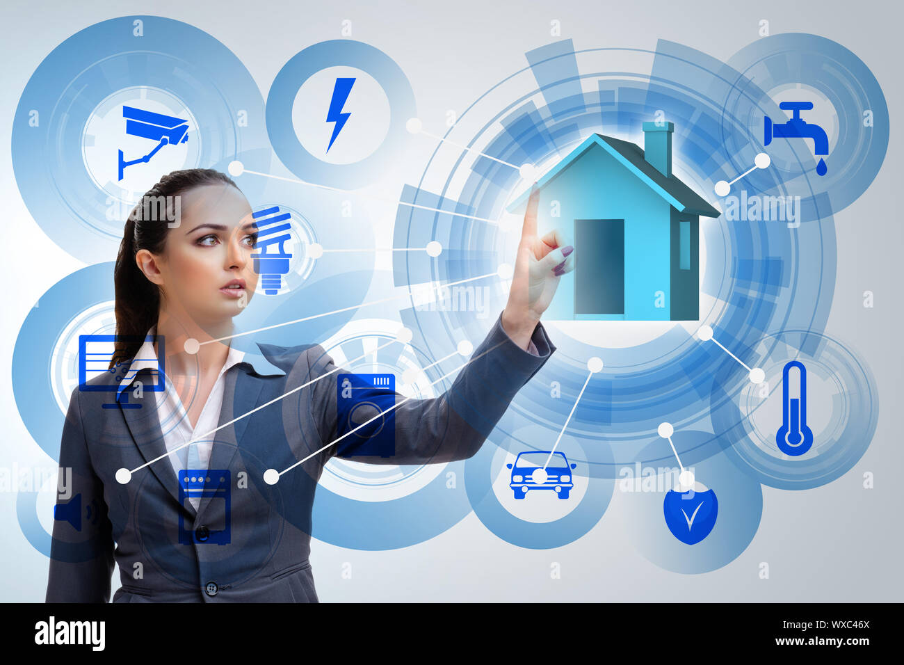 Smart home concept with woman Stock Photo - Alamy