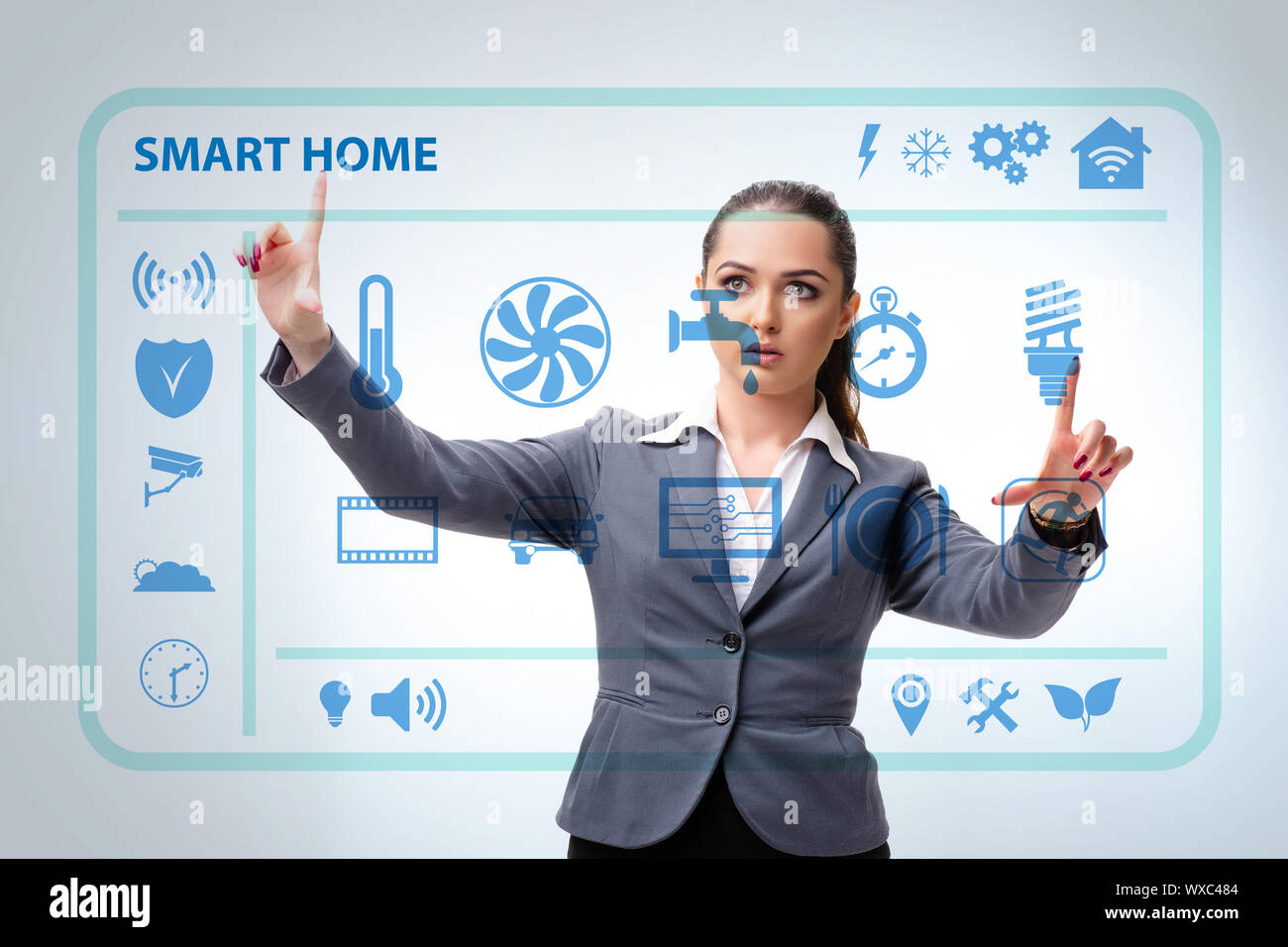 Smart home concept with woman Stock Photo - Alamy