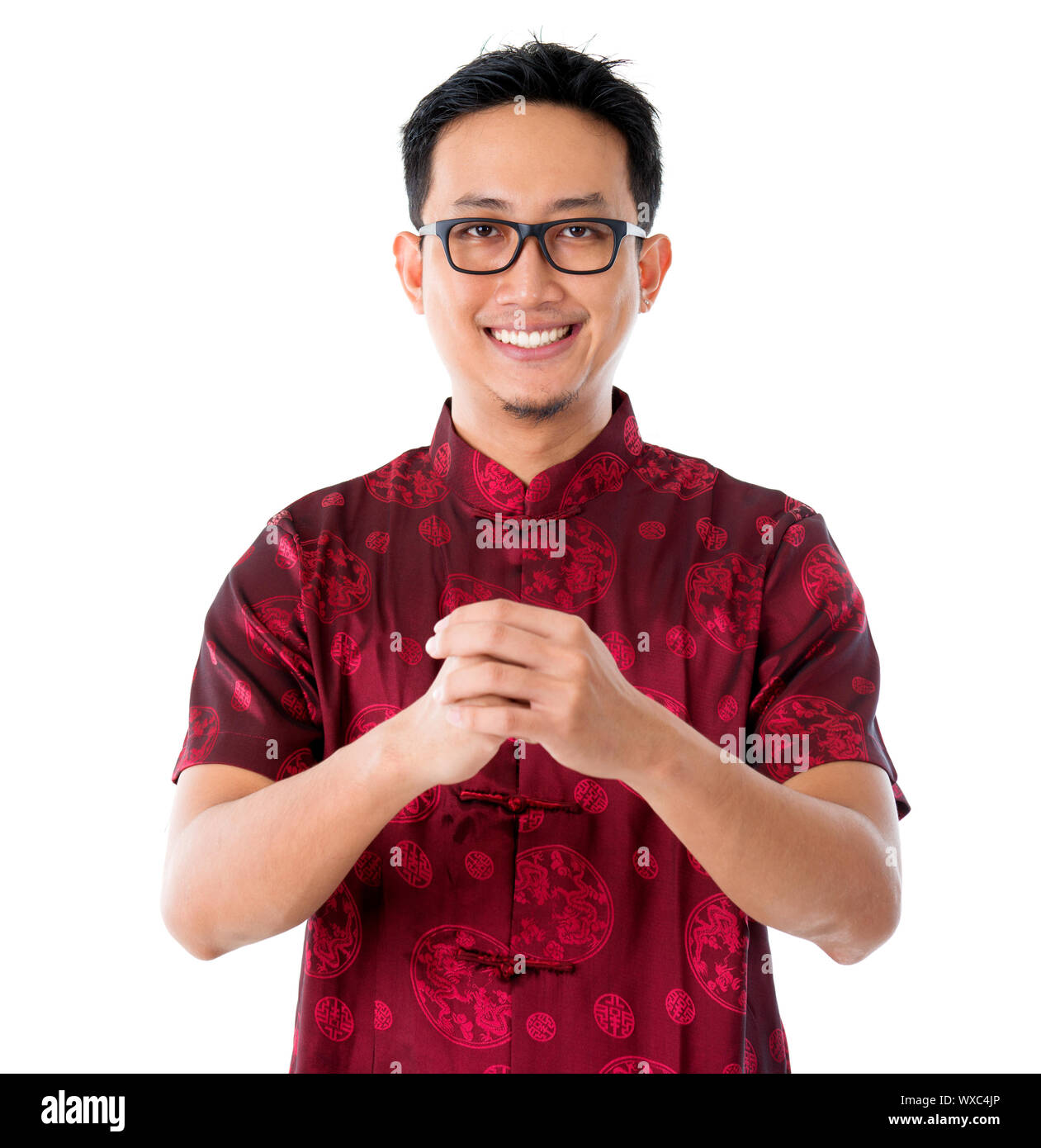 China man in traditional Chinese Tang suit greeting, isolated on white ...