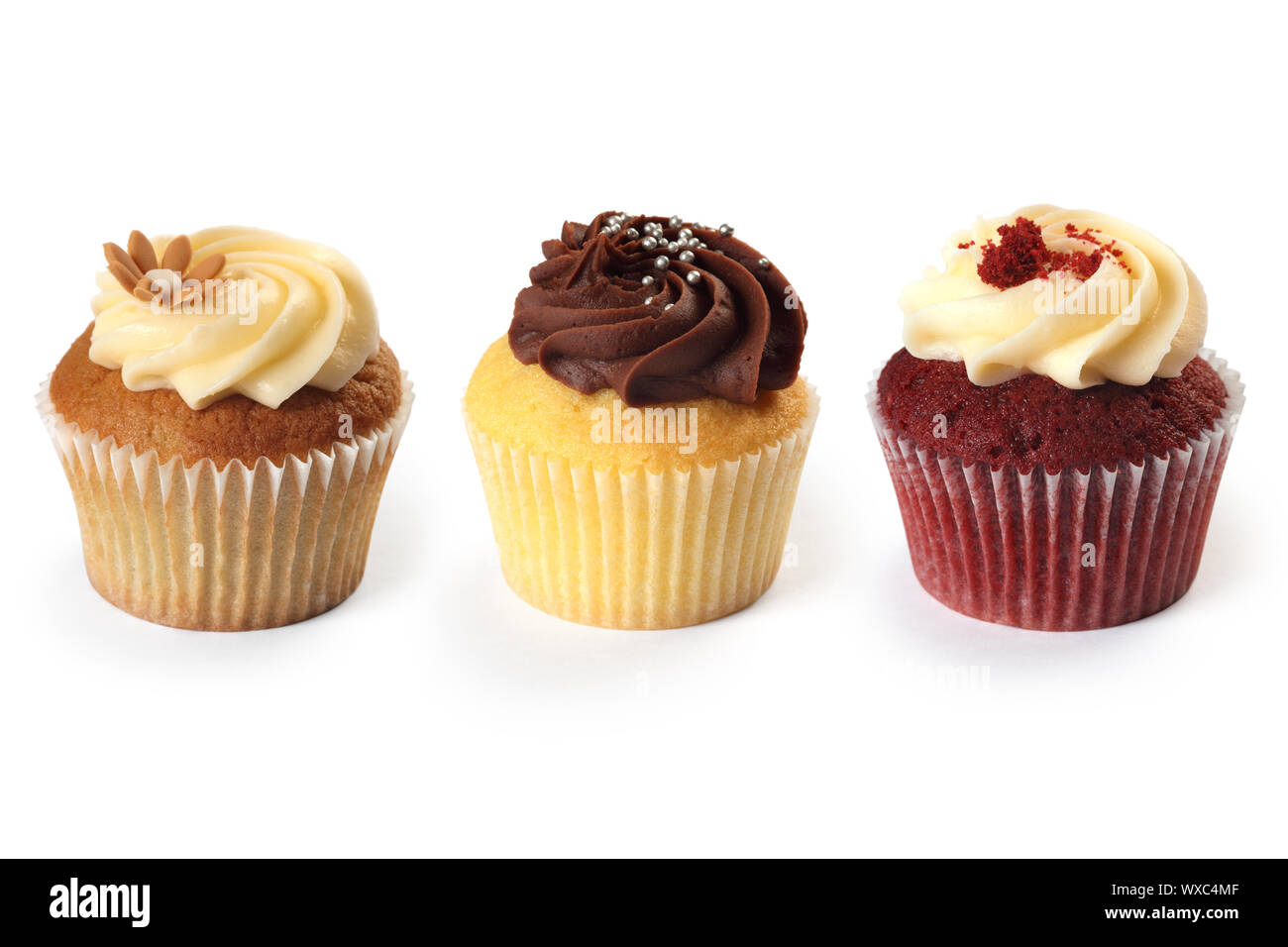 Photo of three different flavored cupcakes on white background Stock ...