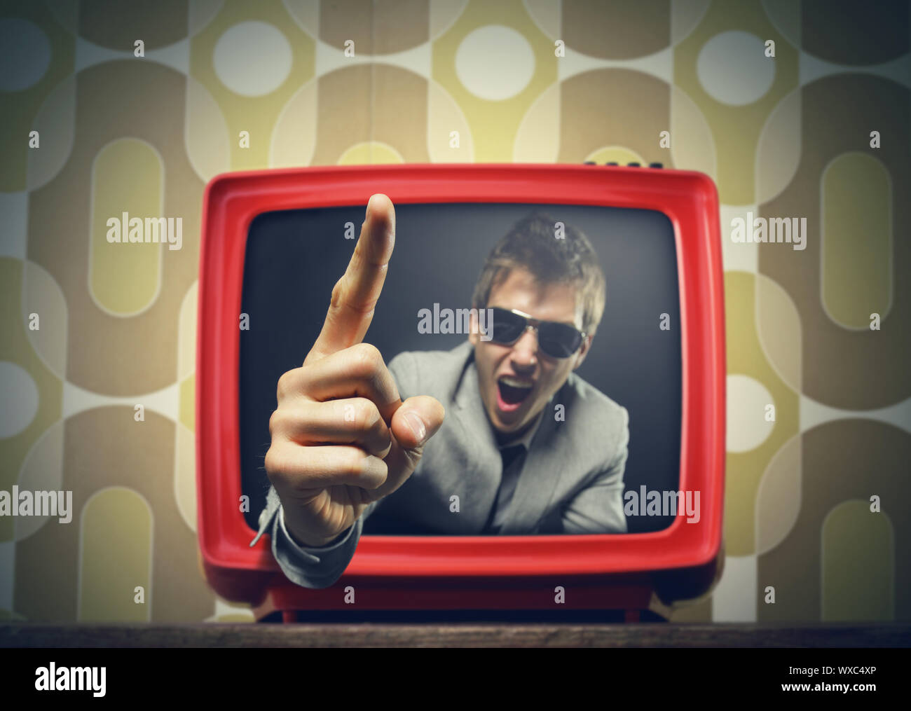 Anchorman pointing his finger and screaming in vintage tv Stock Photo ...