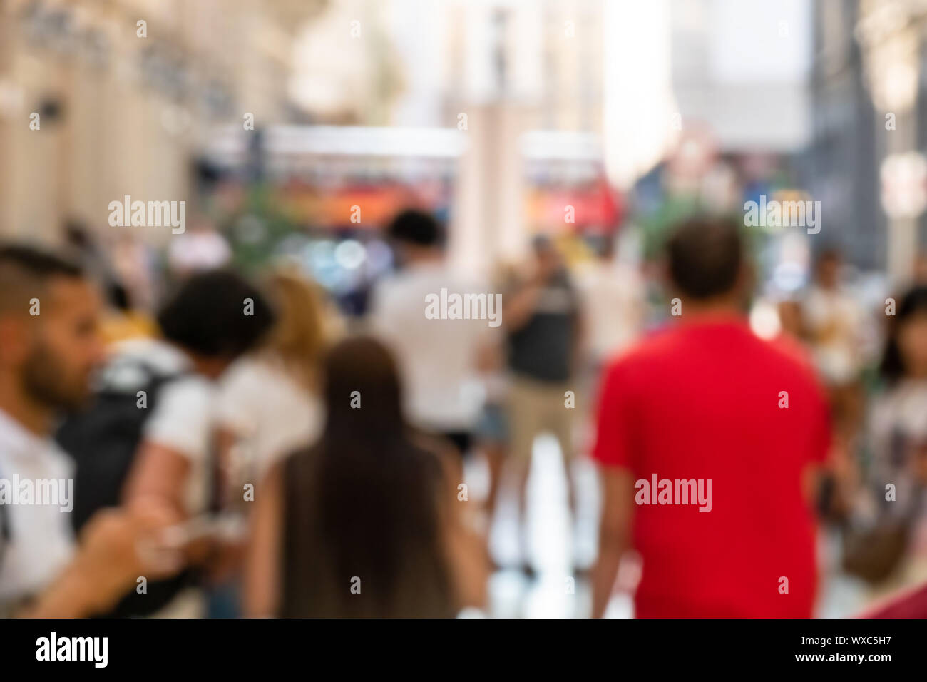 An image of walking people blurred background Stock Photo - Alamy