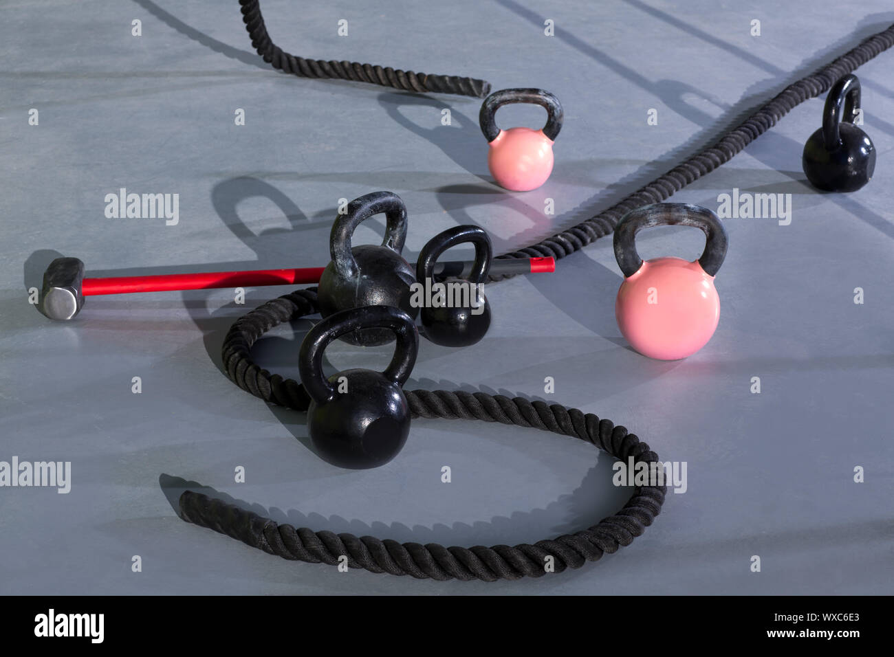 Crossfit Kettlebells ropes and hammer in fitness gym floor Stock Photo ...