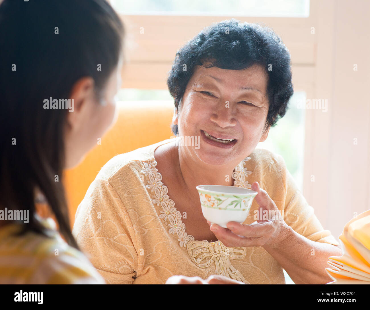Asian Chinese family having breakfast in restaurant Stock Photo - Alamy