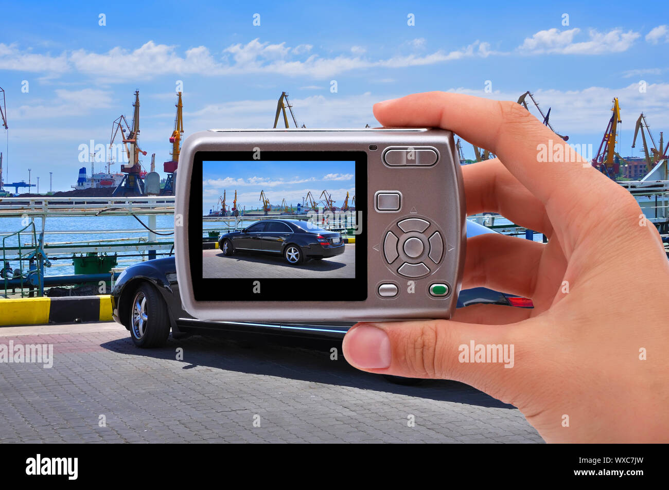 digital camera in hand, isolated Stock Photo - Alamy