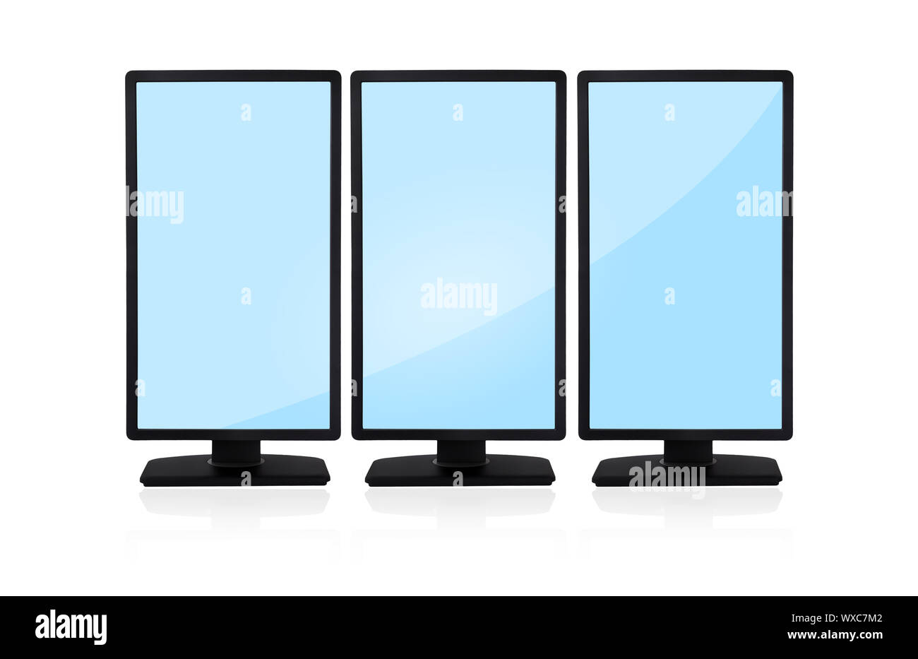three vertical computer monitor on white background Stock Photo - Alamy