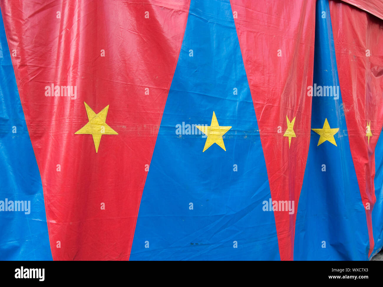 A circus tent with red and blue triangles and yellow stars Stock Photo ...