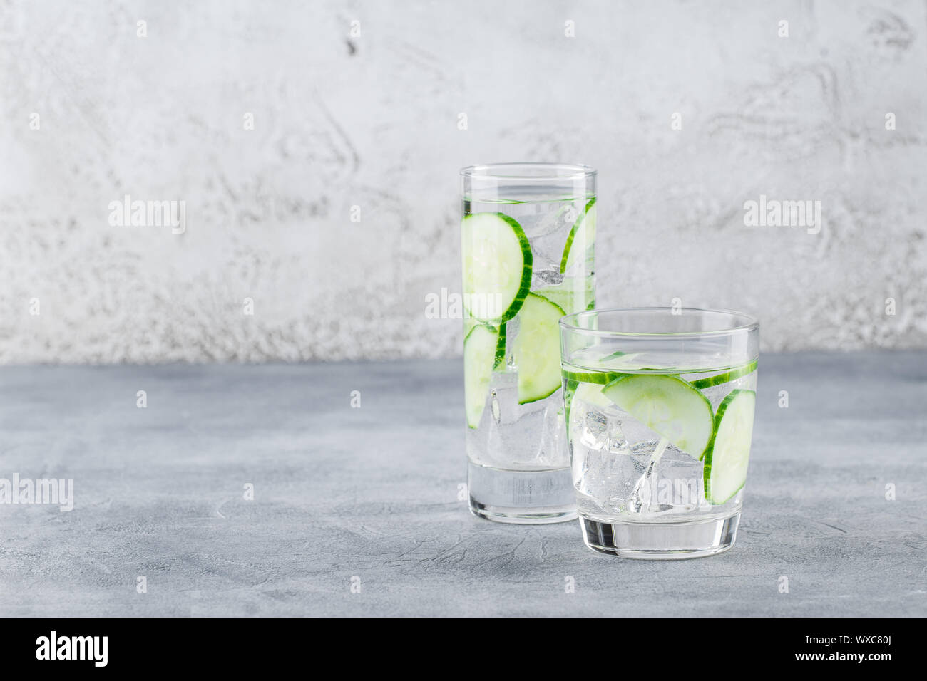 Infused water with cucumber and ice Stock Photo - Alamy