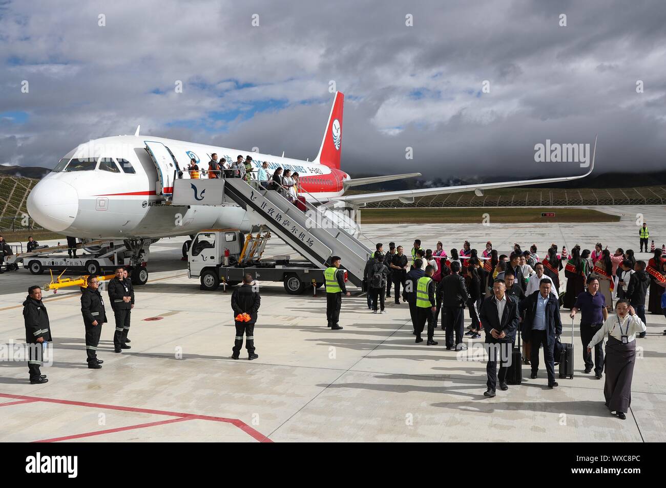 Garze, China's Sichuan Province. 16th Sep, 2019. Passengers disembark ...