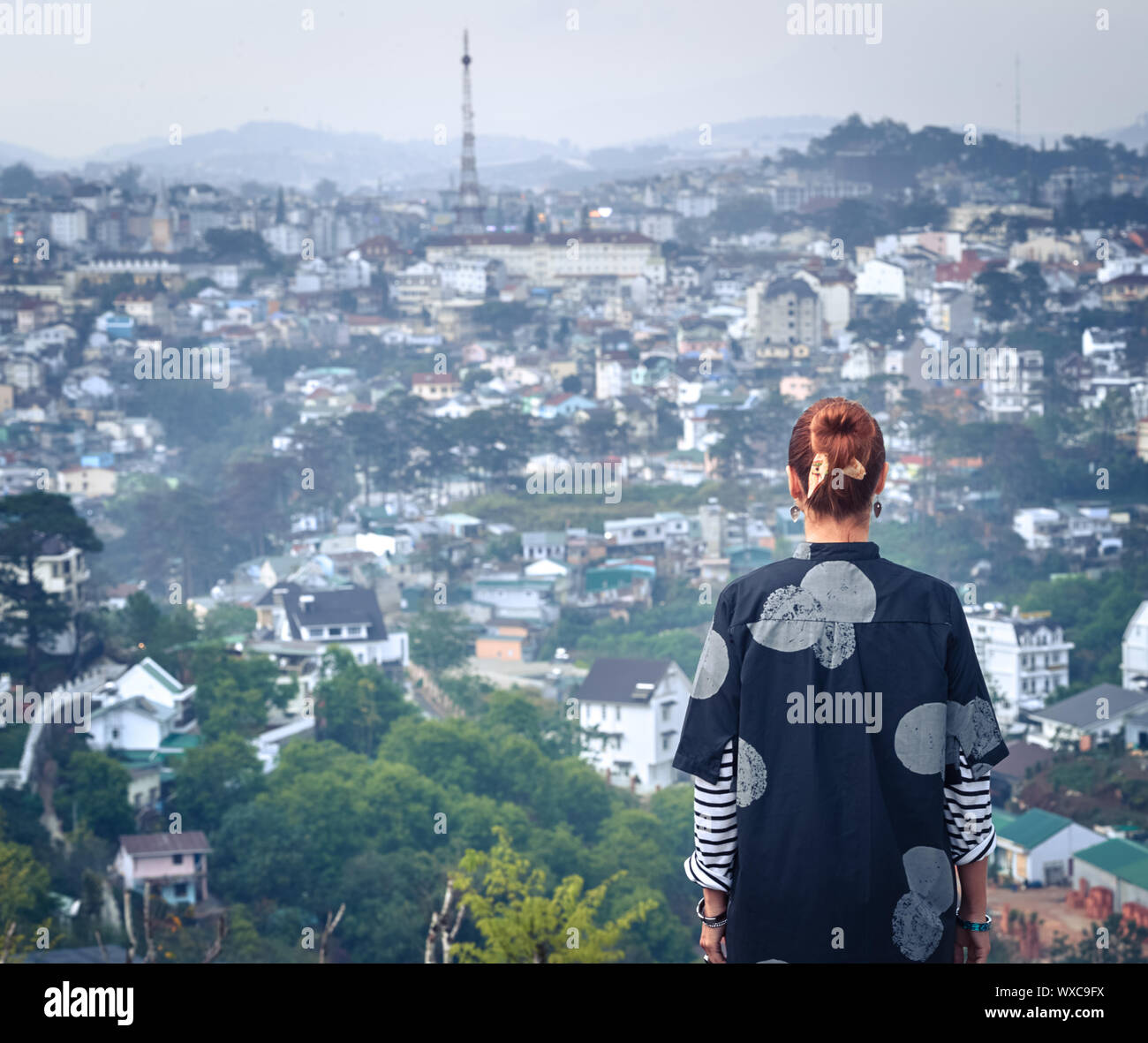 Woman overlooking town architecture hi-res stock photography and images ...