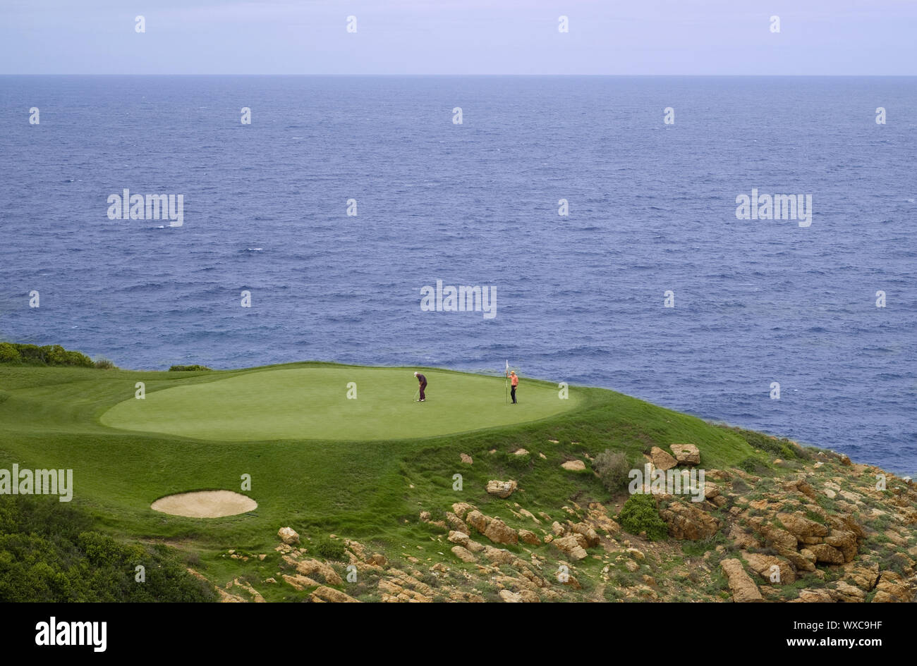 Perfect golf green hole at the sea Stock Photo - Alamy