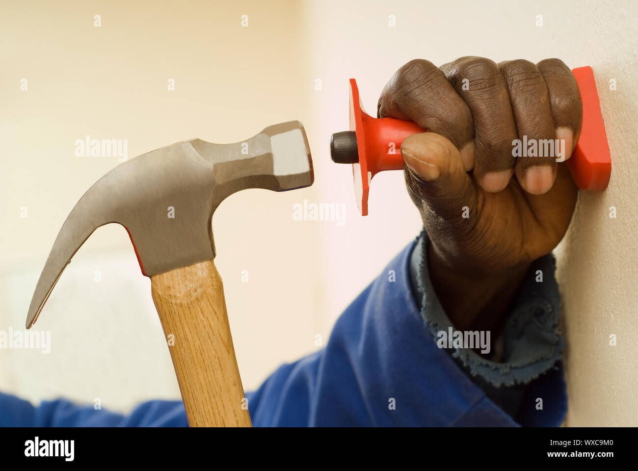 African American Construction Worker Handyman Holding Hammer In