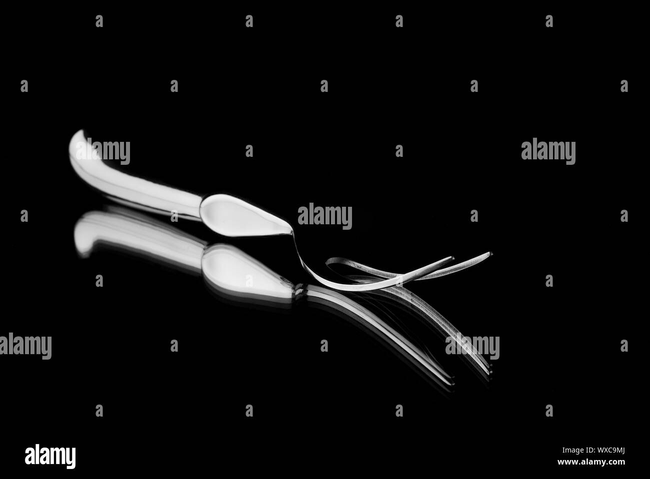 Single carving fork reflection on mirror with black background Stock ...