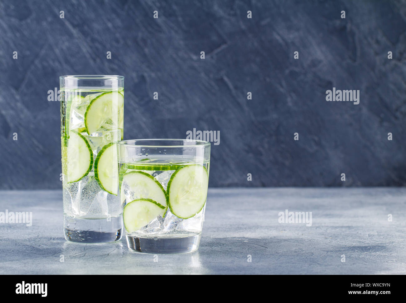 Infused water with cucumber and ice Stock Photo - Alamy