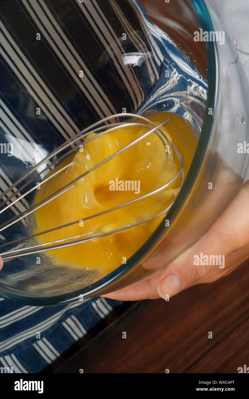 Woman cook or chef whisk, whisking or mixing egg mixture Stock Photo ...