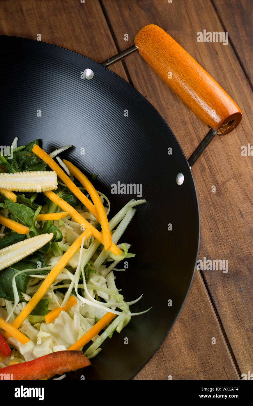 Raw stir fry food in wok ready for cooking Stock Photo - Alamy
